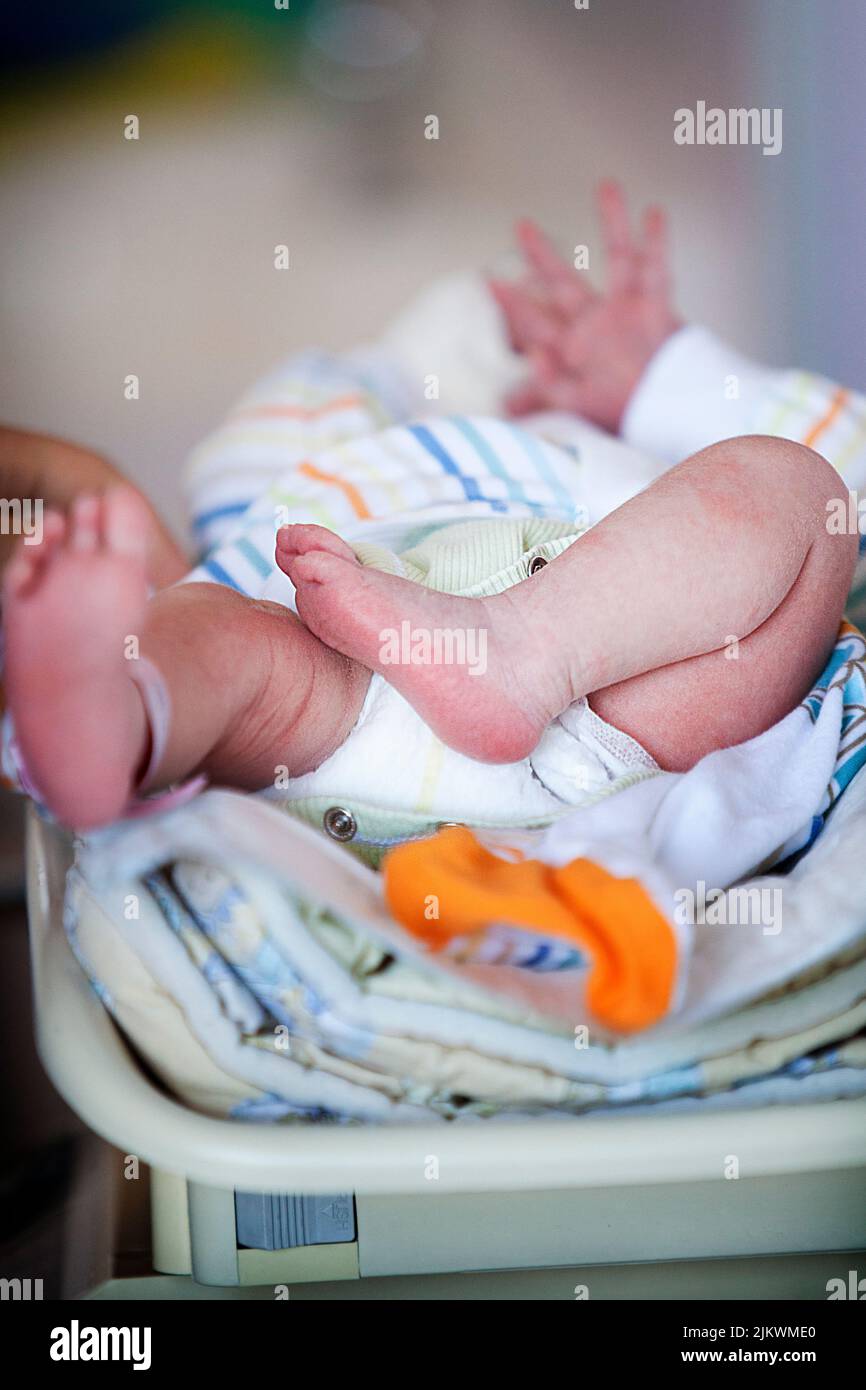 Level 2 neonatal ward of a hospital, weighing a premature baby Stock ...