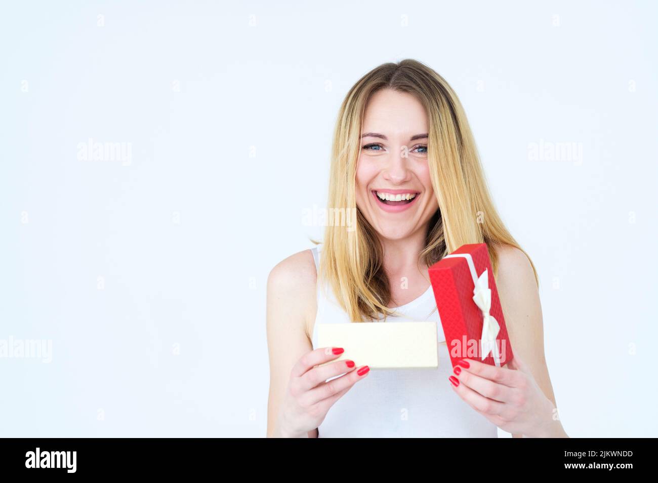 joy smile woman present gift box holiday greeting Stock Photo - Alamy