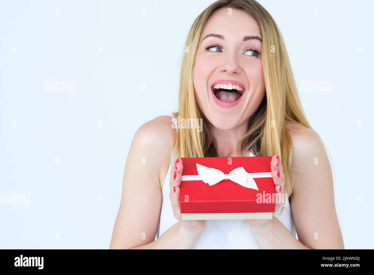 thrilled excited woman gift box surprise present Stock Photo - Alamy