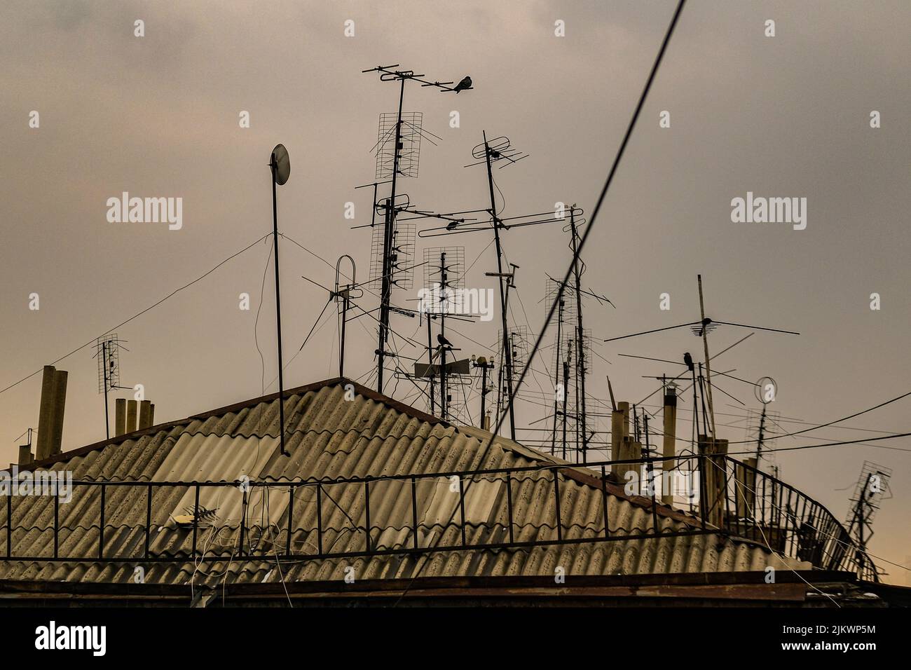 An urban scene with satellite antennas on the roof of a building Stock ...