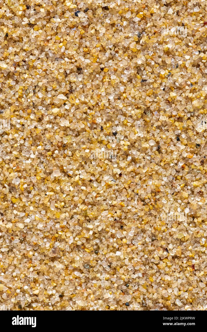 Large grains of sand on a beach, colorful background Stock Photo - Alamy