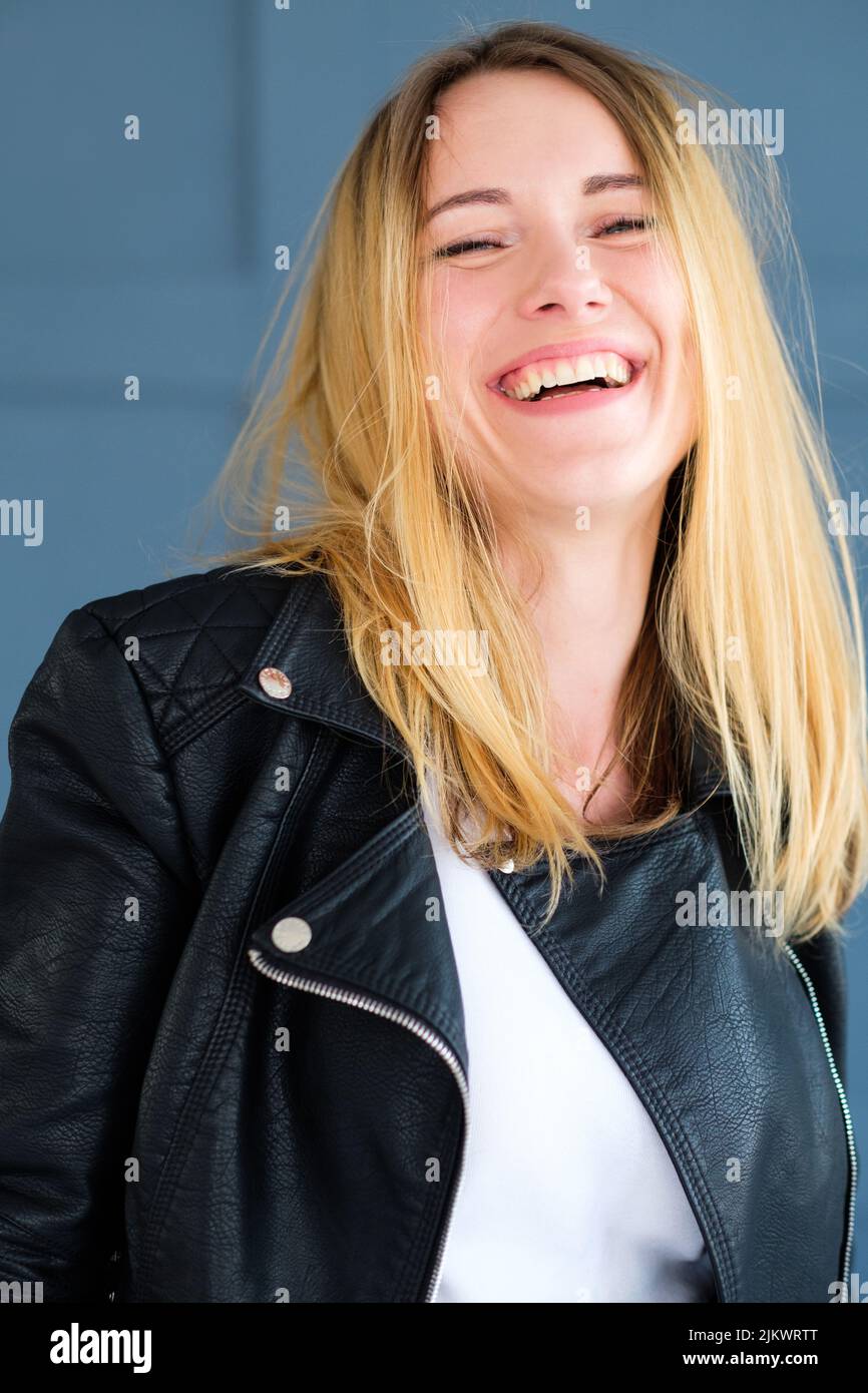 happy thrilled girl beaming smile rocker jacket Stock Photo - Alamy
