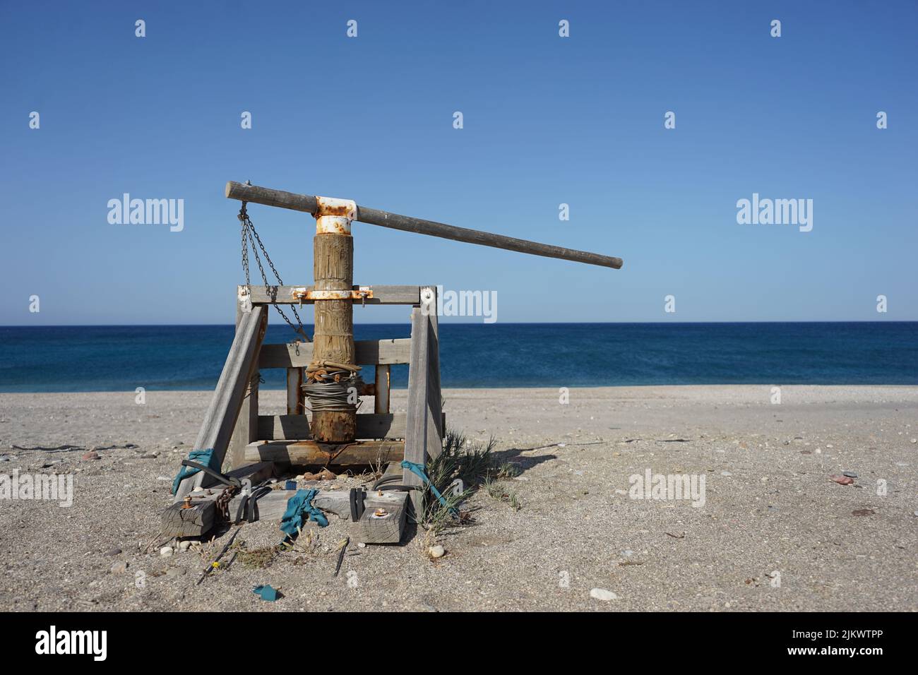 An old wooden boat winch at a beach at Cabo de Gata-Nijar natural park ...