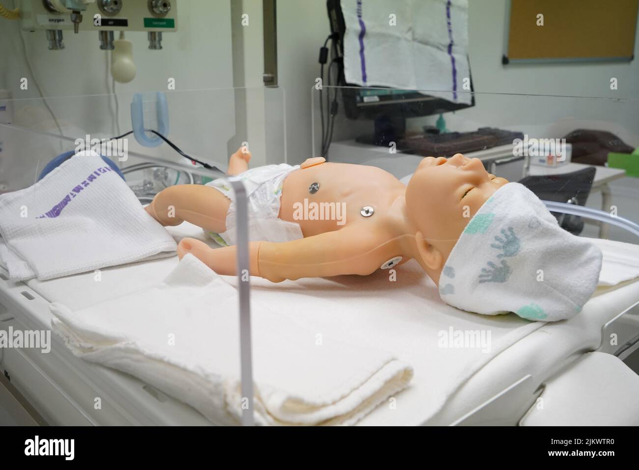 New born mannequin during a pediatric resuscitation simulation workshop ...