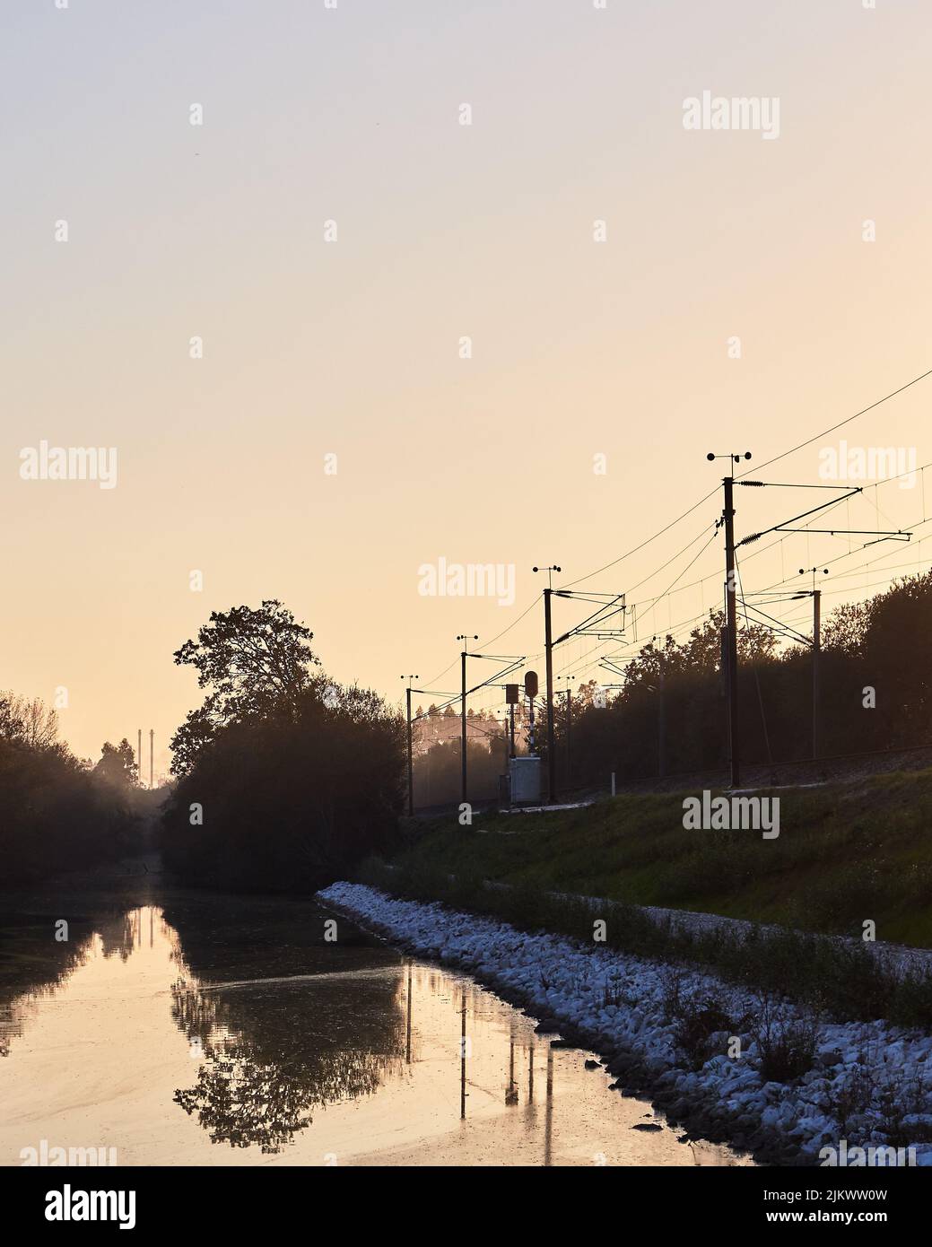 A view of train tracks near a canal in spring looking beautiful in ...