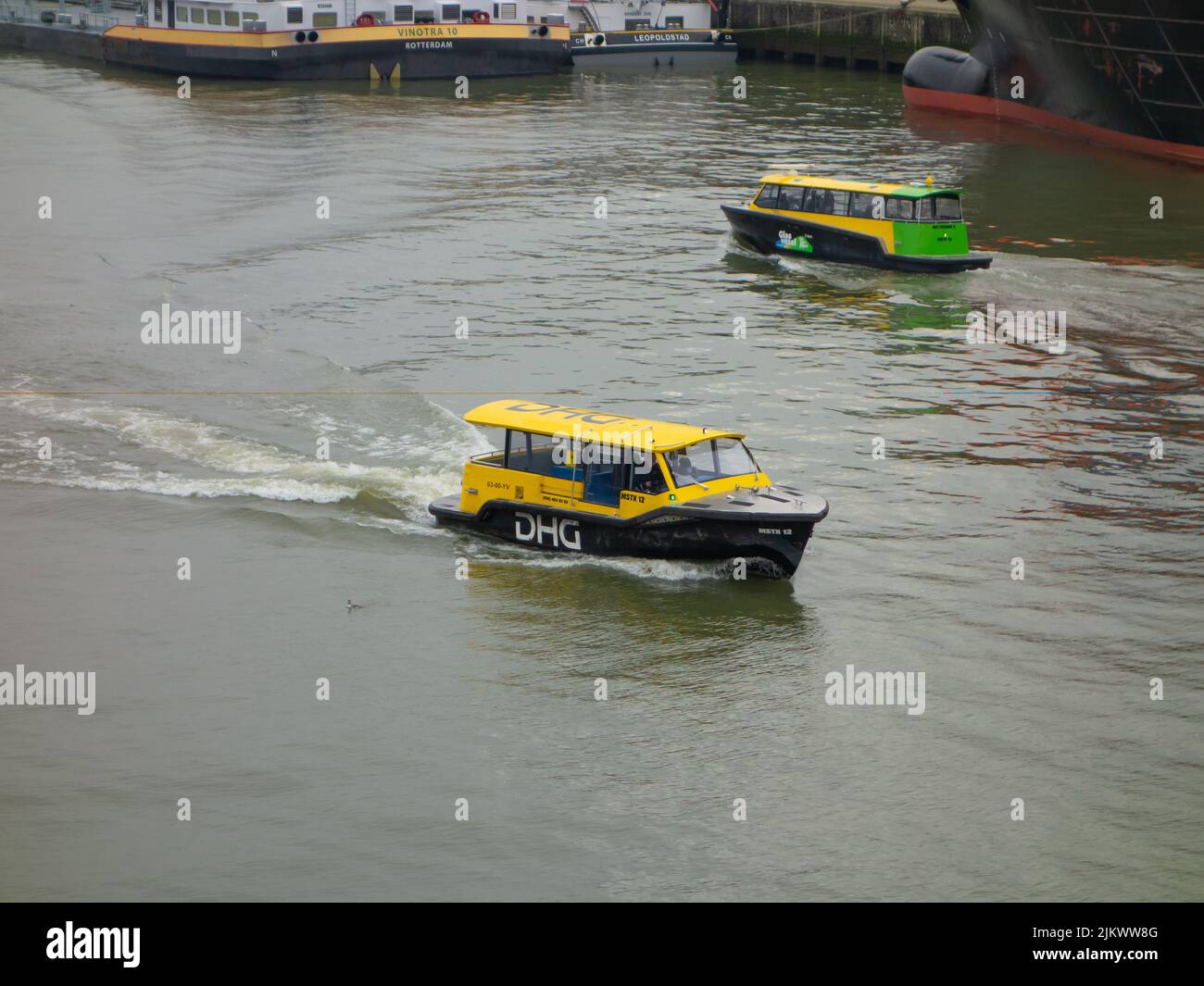 Water Taxi underway in waters of Rotterdam. Two taxis passing each ...