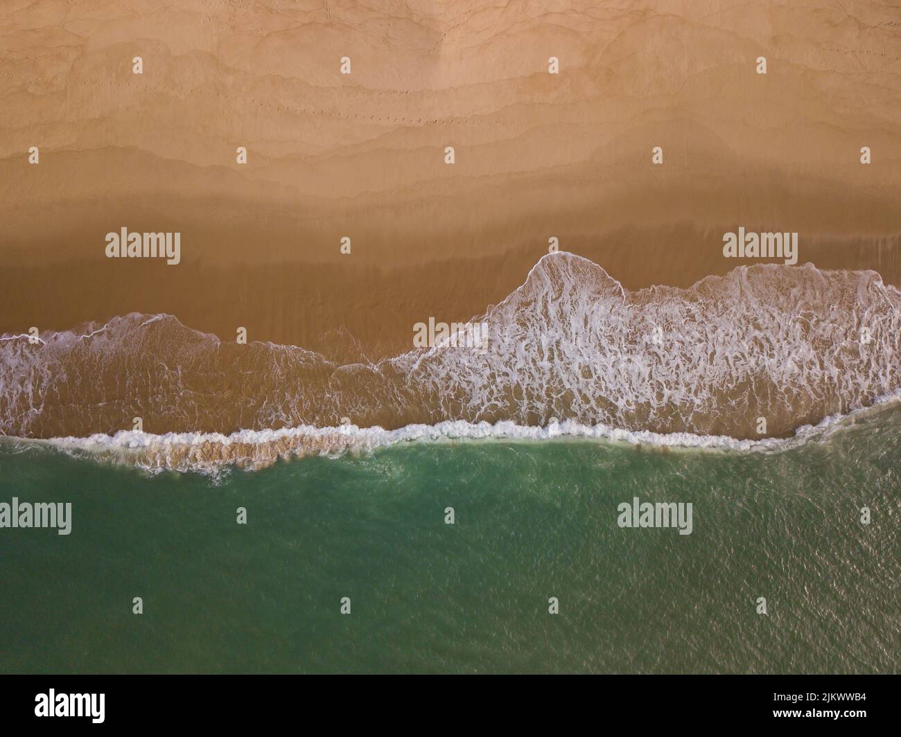 Waves washing on beach of Atlantic ocean. Waves breaking up on beach ...