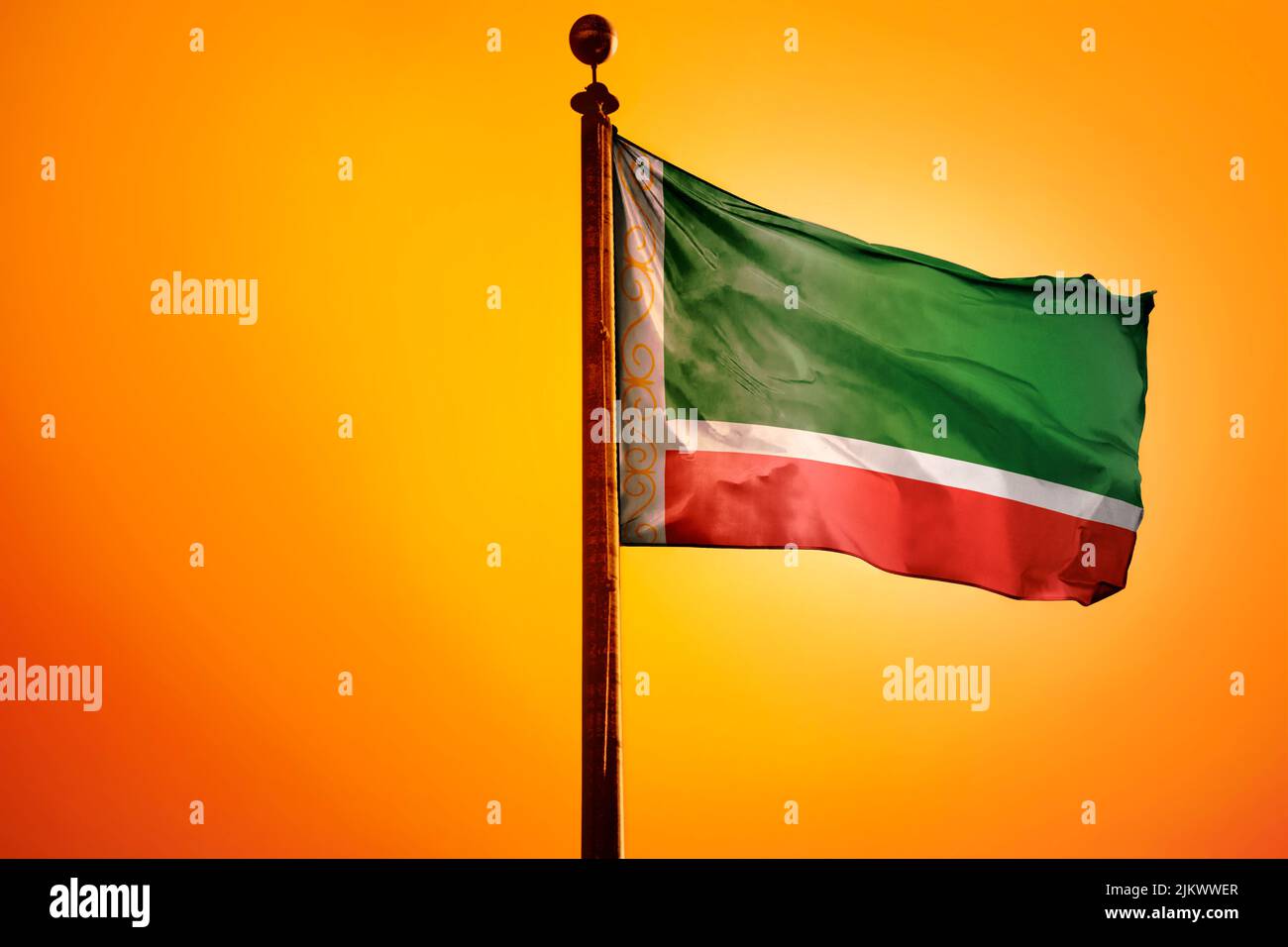 A digital illustration of the flag of Chechnya waving against a bright ...