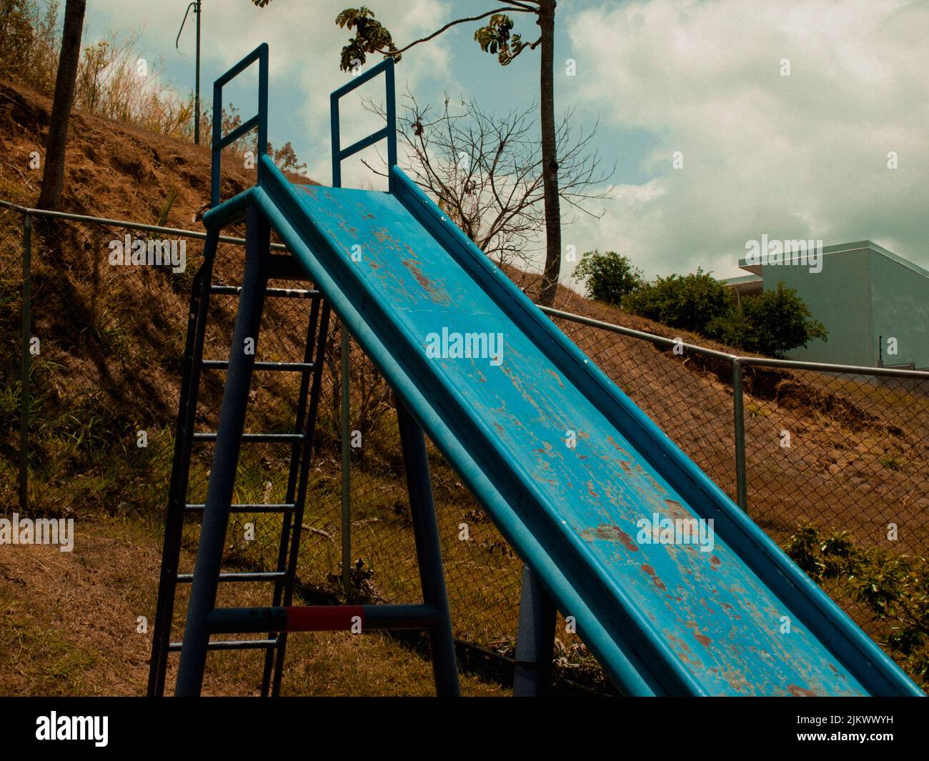 A beautiful shot of blue Children's slide in garden inside a ...