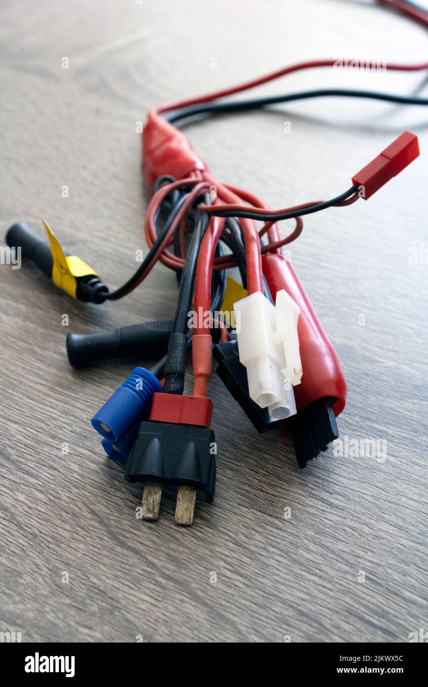 A vertical shot of battery wire bundle connectors for chargers on ...