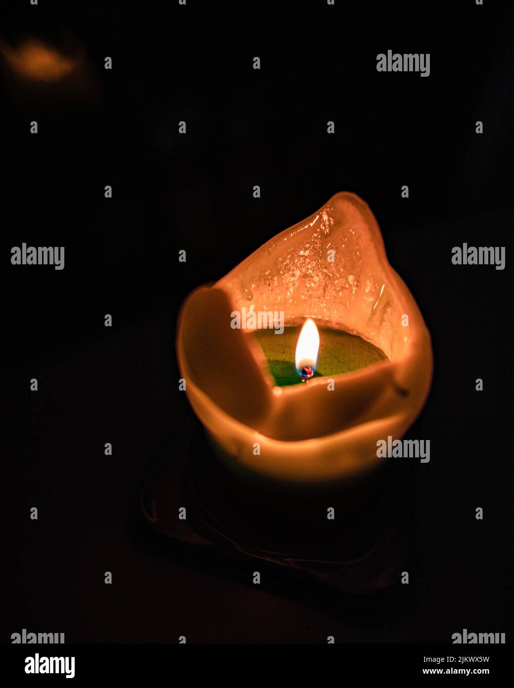 Candle burning flame in the dark. Texture on the wax Stock Photo - Alamy