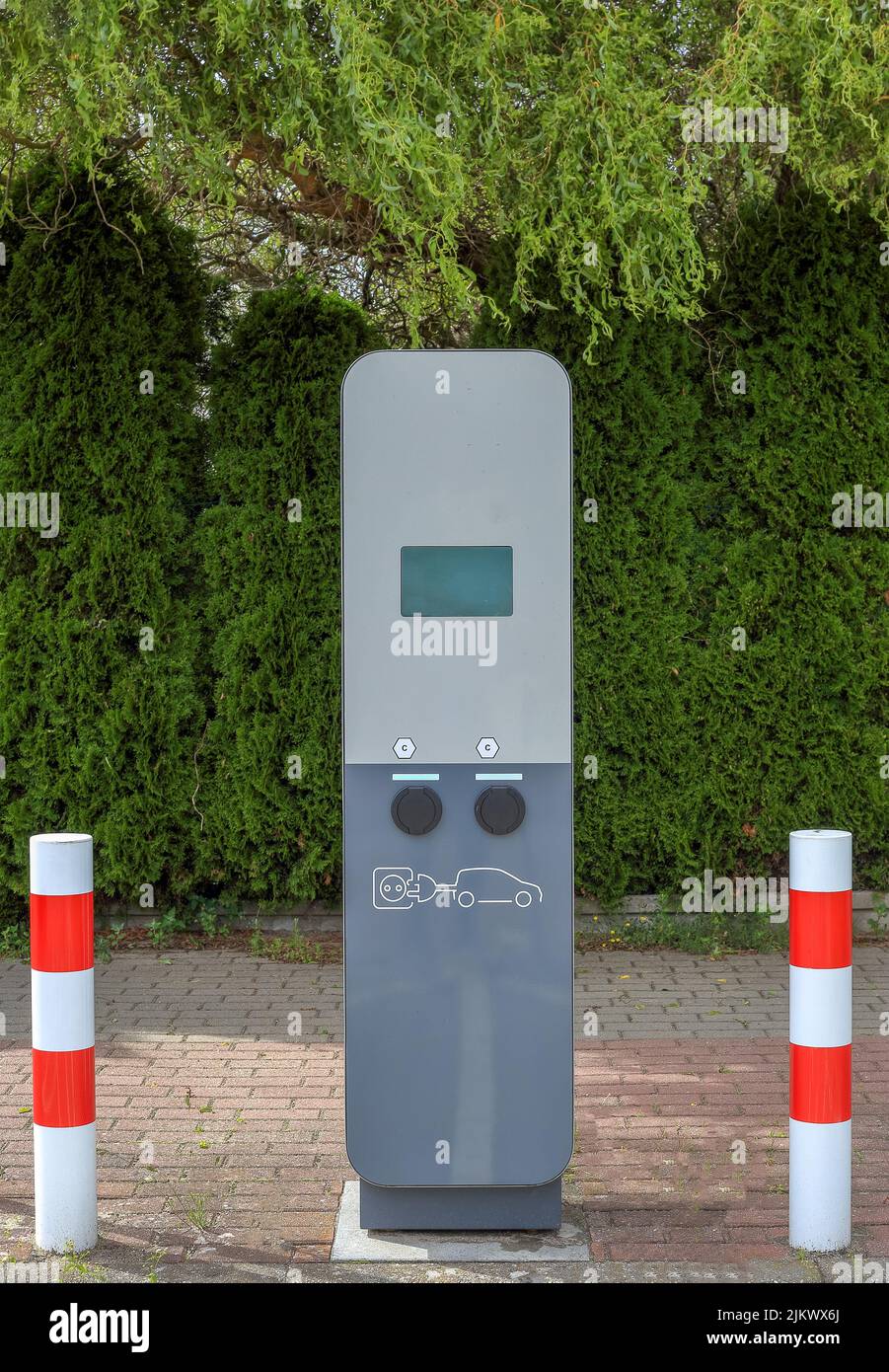Grey electric vehicle charging station in Poland Stock Photo - Alamy