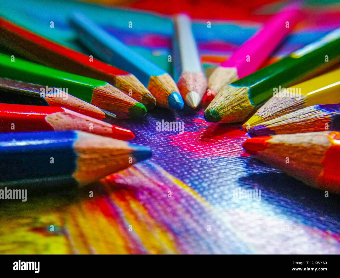 Stock photo of color pencil crayons roundly arranged and pointing into ...