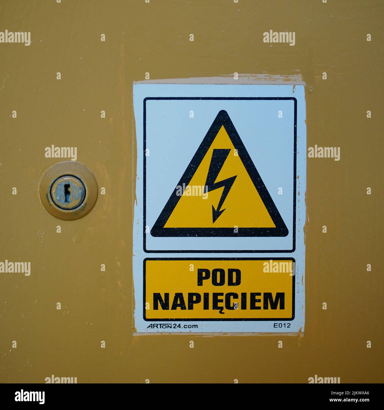 A Polish sticker warning for electrical hazard Stock Photo - Alamy
