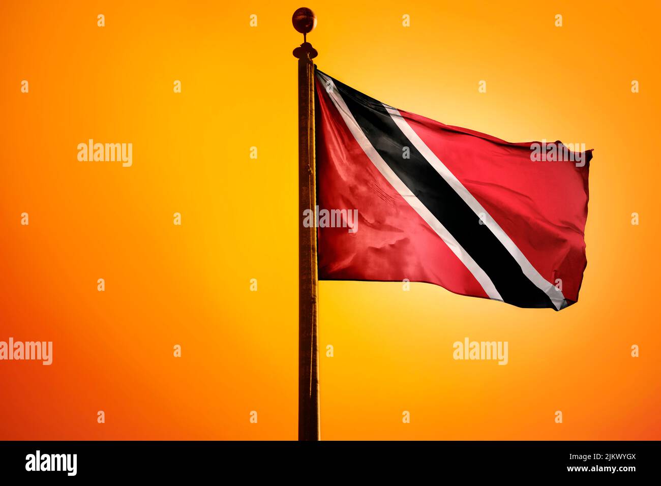 A 3D rendering of a waving flag of Trinidad and Tobago on a pole on an ...