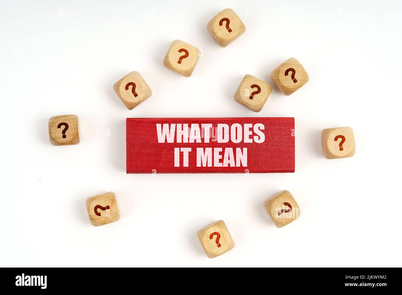 Question concept. On the table are cubes with questions and a red ...