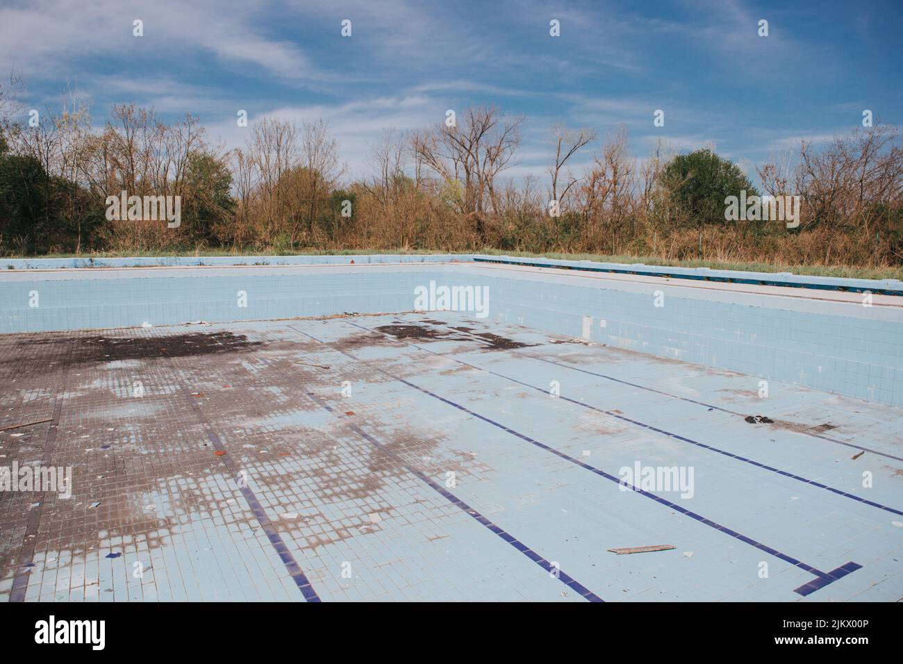 An old empty dry outdoor swimming pool in a dry park Stock Photo - Alamy