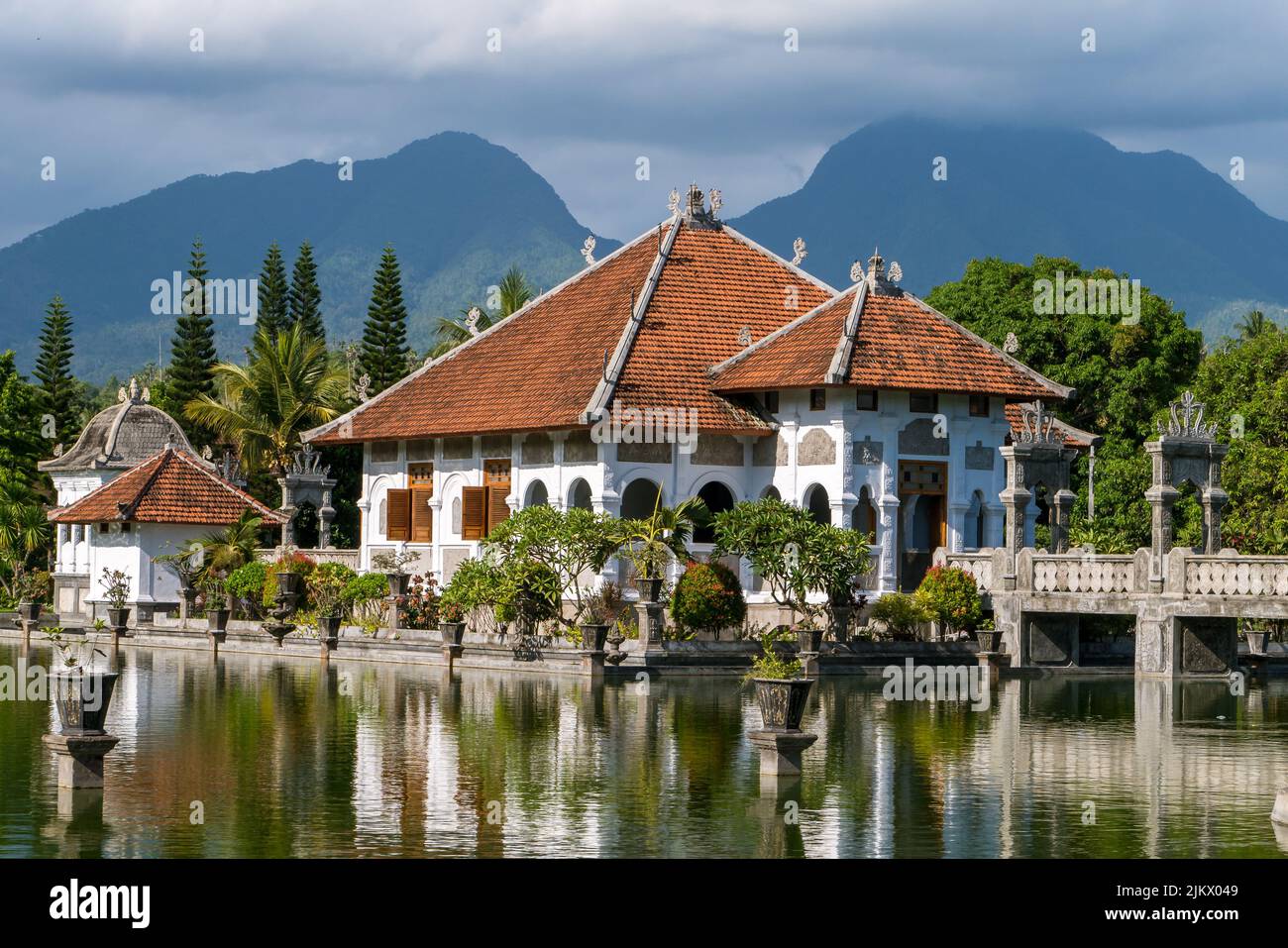 A scenic view of the Balinese temple with the reflection on the water ...
