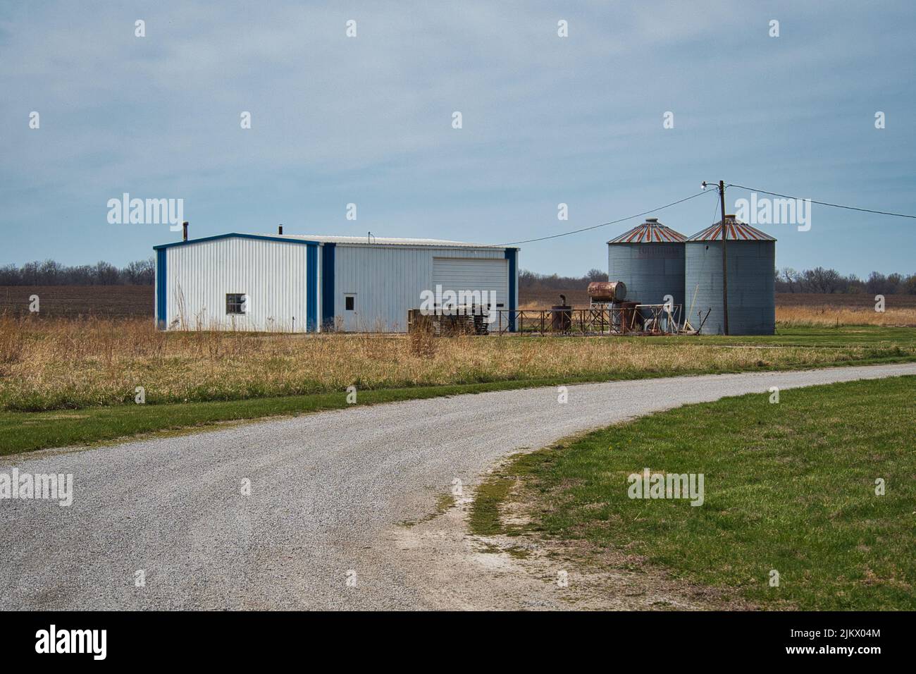 A natural view of a street and farmland near Carrollton Missouri, USA ...