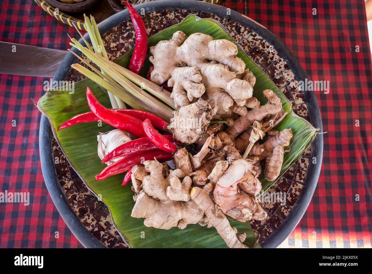 A closeup shot of spices on a green banana leaf for cooking Balinese ...