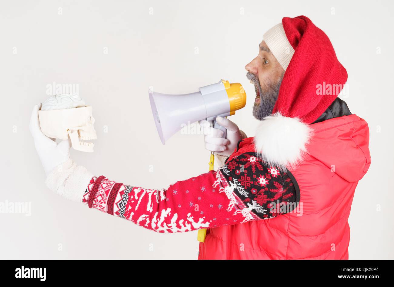 New Year and Christmas concept. Santa Claus speaks into a loudspeaker ...