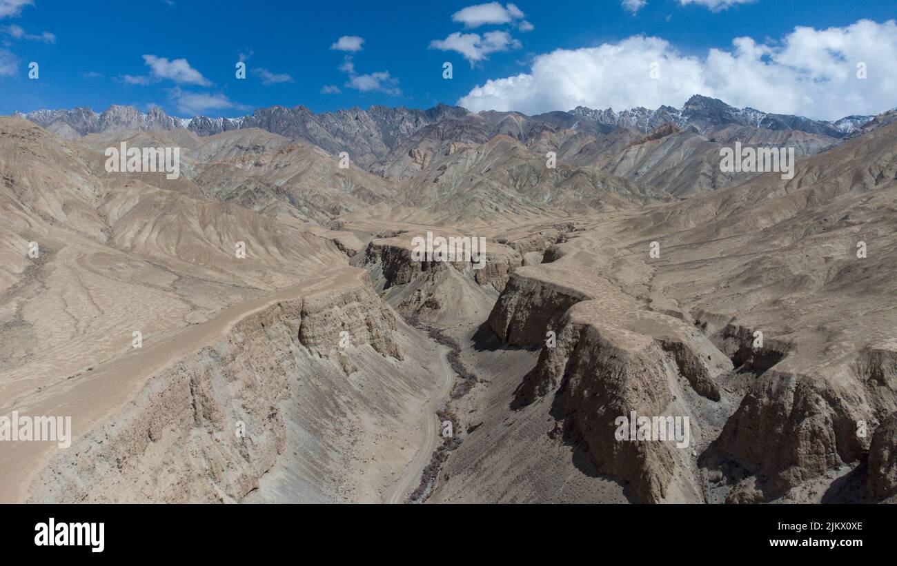 An aerial view of the vast canyon and curved roads of Logar in ...