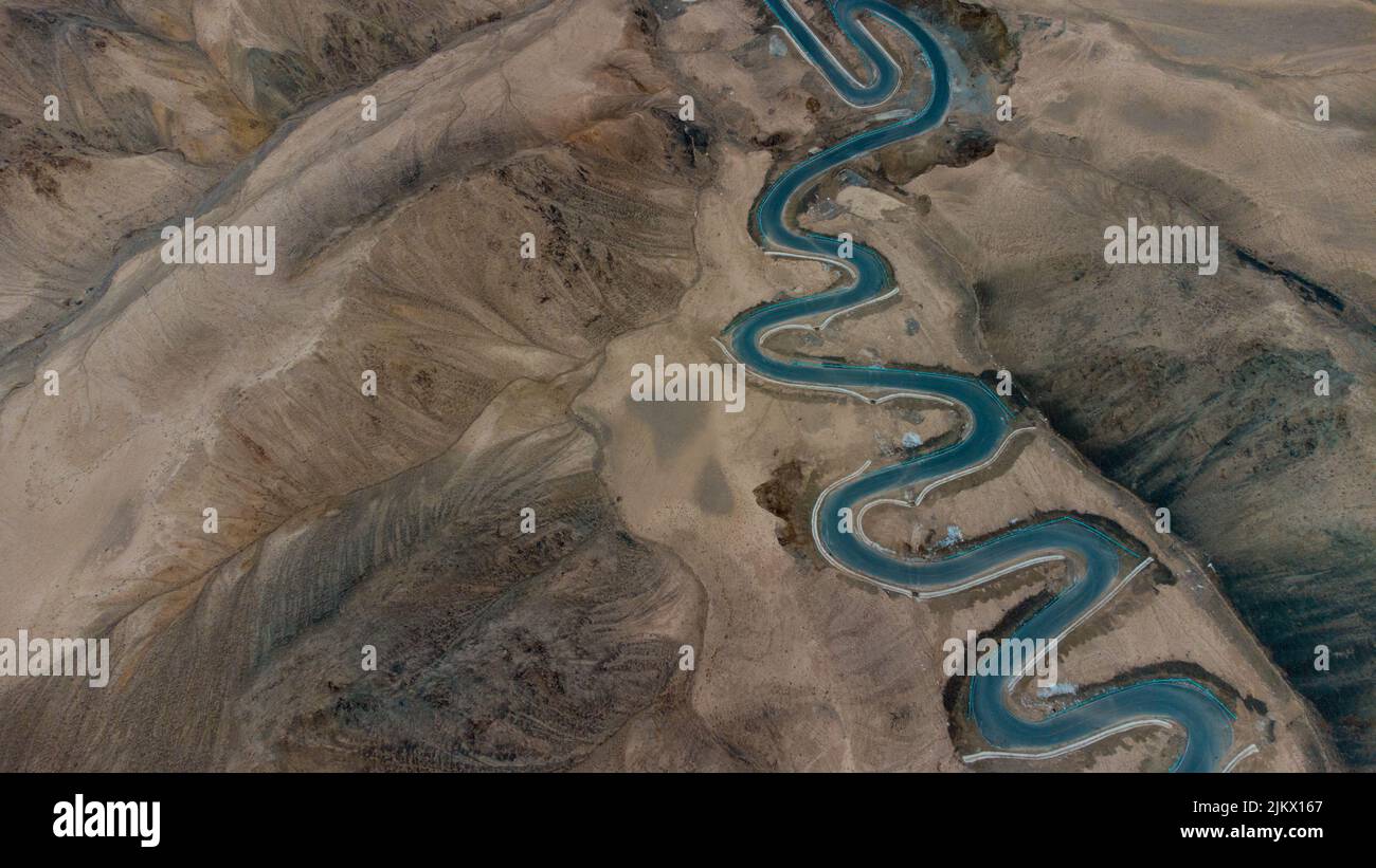 An aerial view of a winding race road in the hills of a desert Stock ...