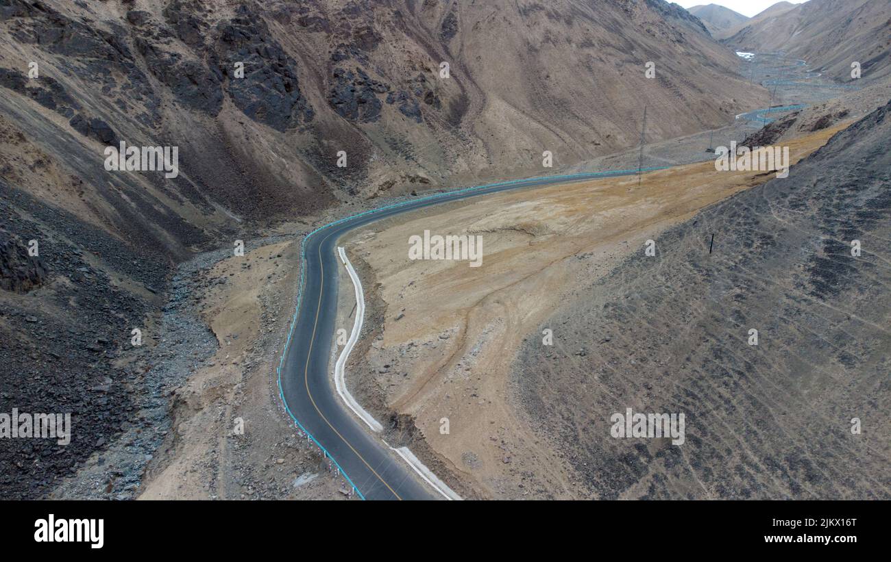 An aerial view of a race road in the hills of a desert Stock Photo - Alamy