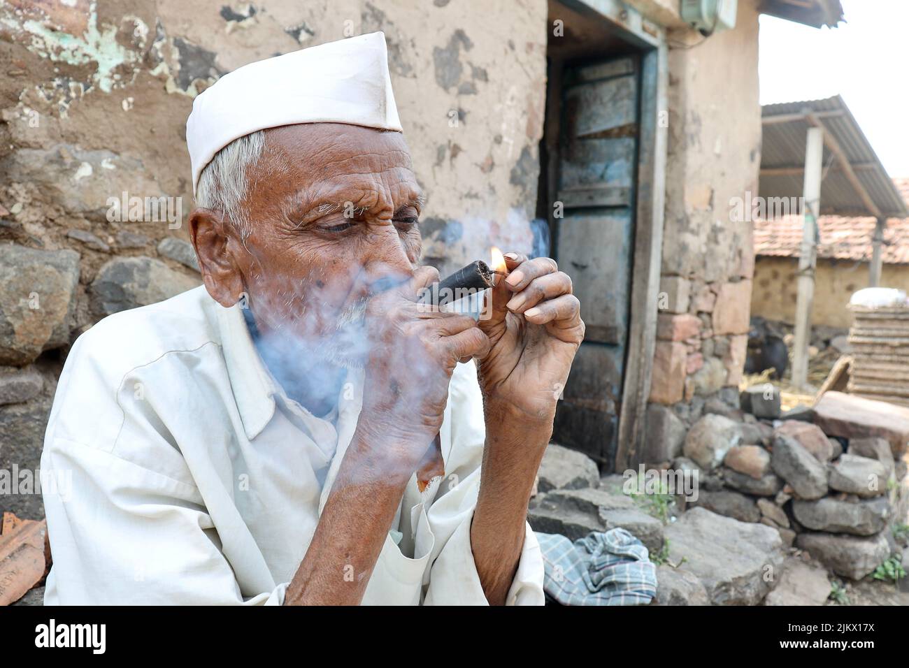 Rural man smoking beedi hi-res stock photography and images - Alamy