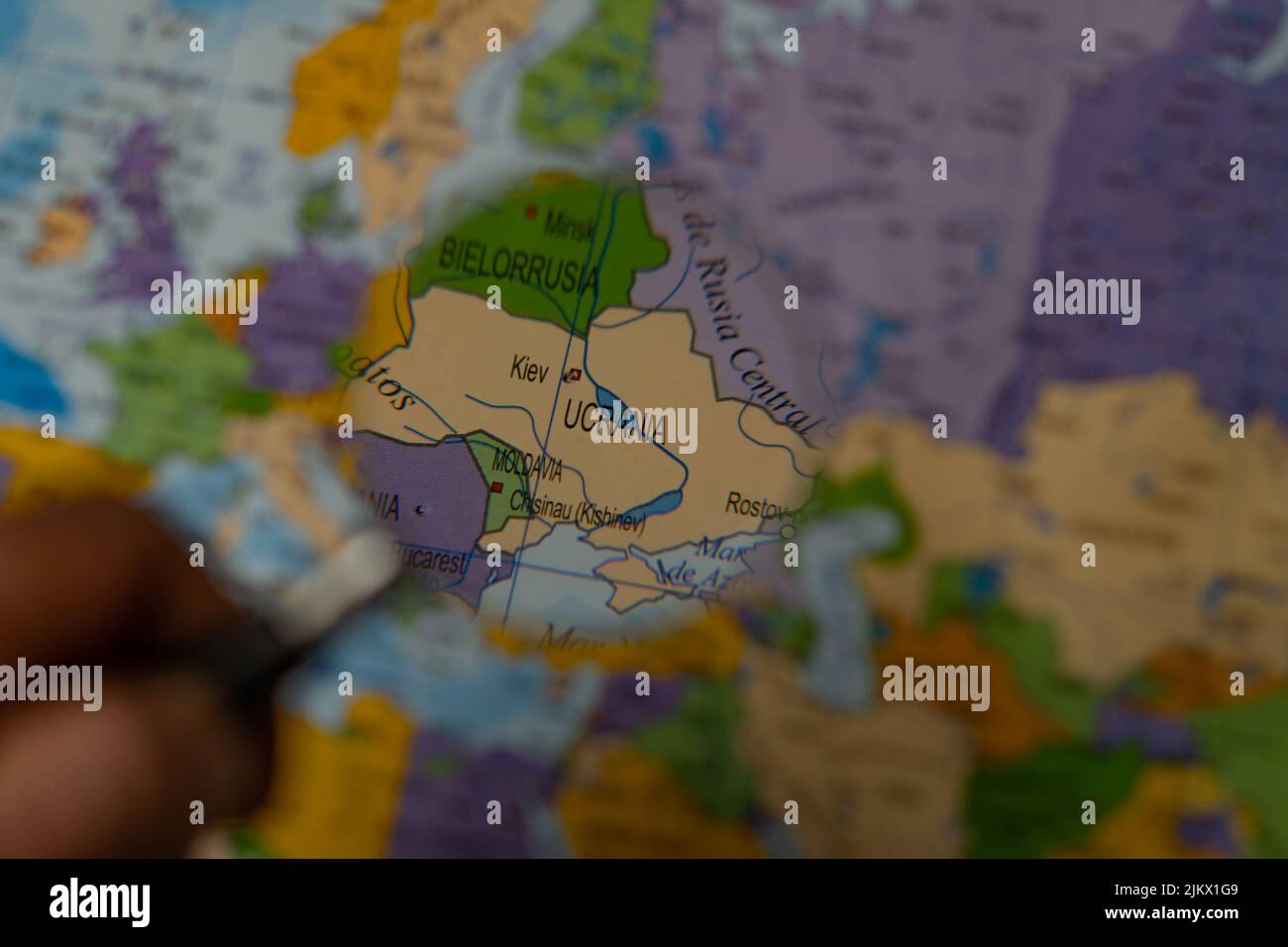 colorful view of ukraine magnified with a magnifying glass, blurred ...