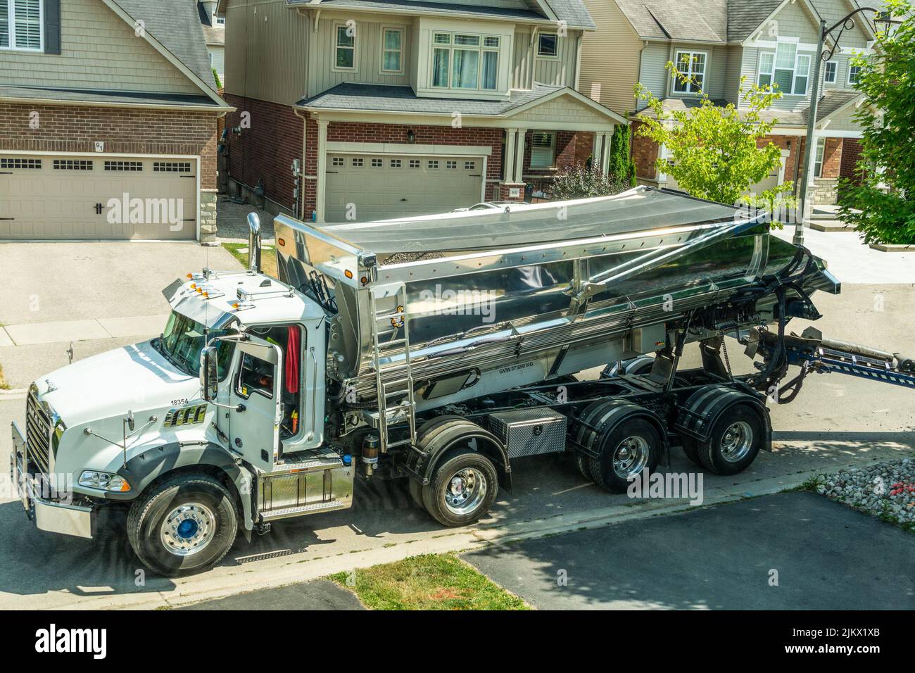 The operator directly from the cab controls the boom supplying the ...