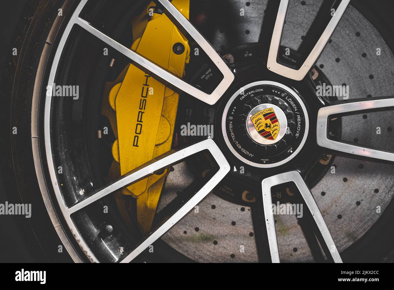A close-up of a Porsche wheel with rim Stock Photo - Alamy