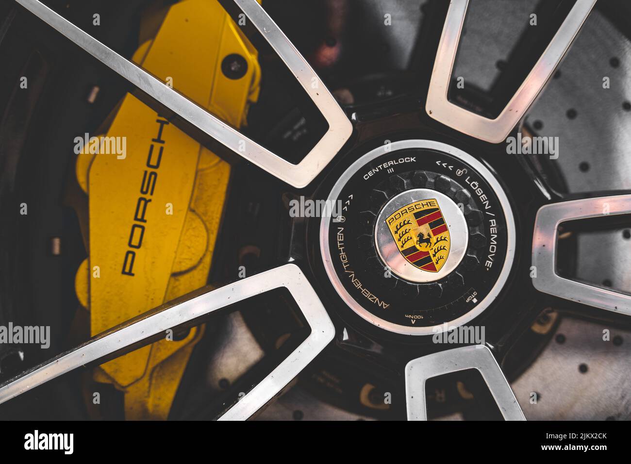 A close-up of a Porsche wheel with rim Stock Photo - Alamy