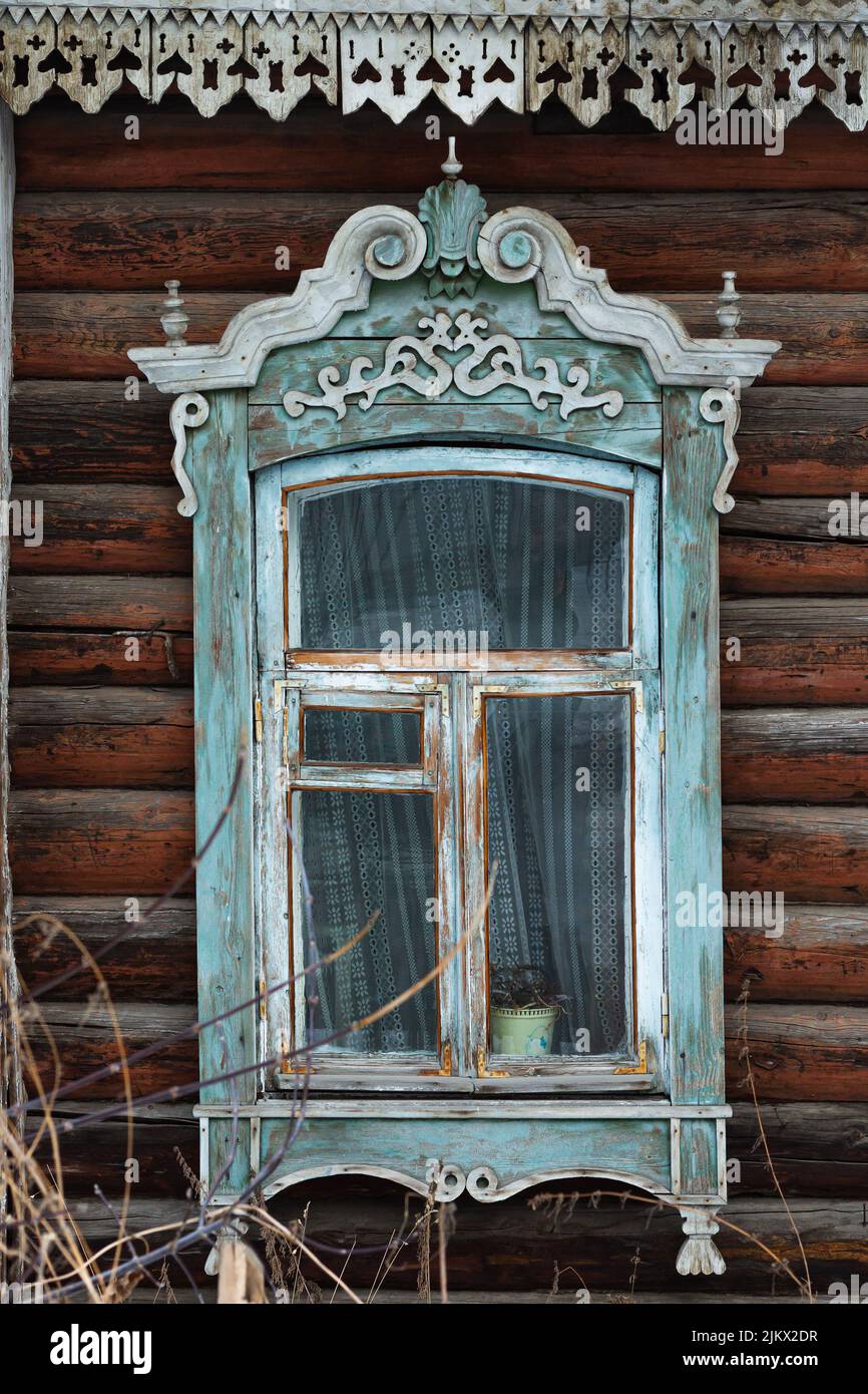 Window in old wooden house. Richly decorated ornamental carved window ...