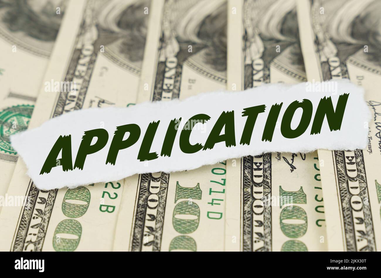 Business and finance concept. On the background of dollars lies a piece ...