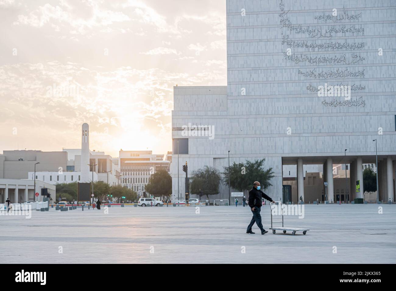 Man pushing a box trolley in a square in Souq Waqif marketplace in Doha ...
