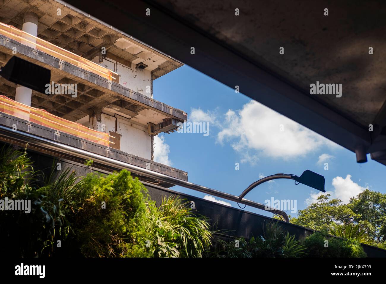 A low angle shot of a building in construction from underneath the ...