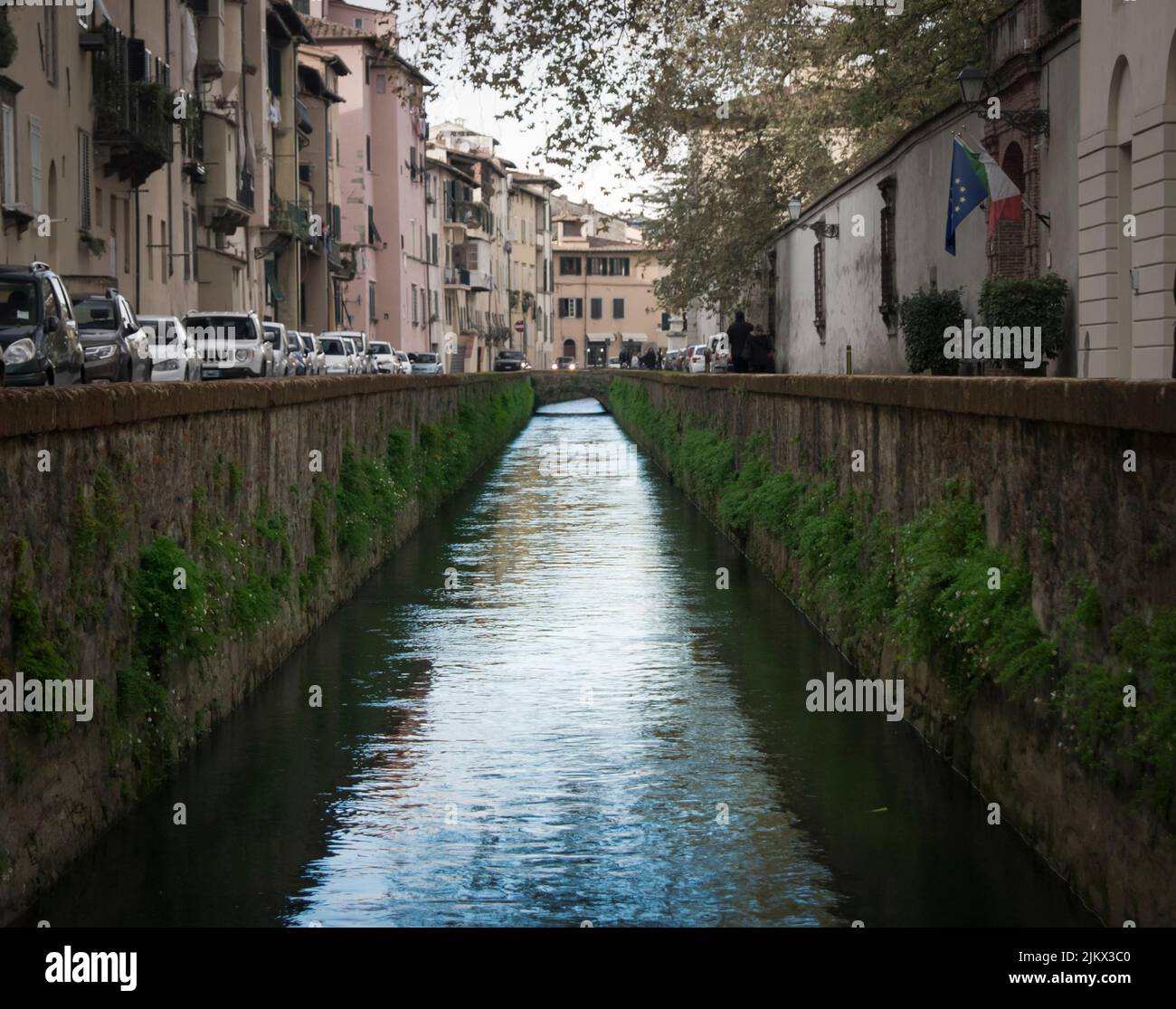Ancient canal that crosses the historic cenmtro of the city of Lucca ...