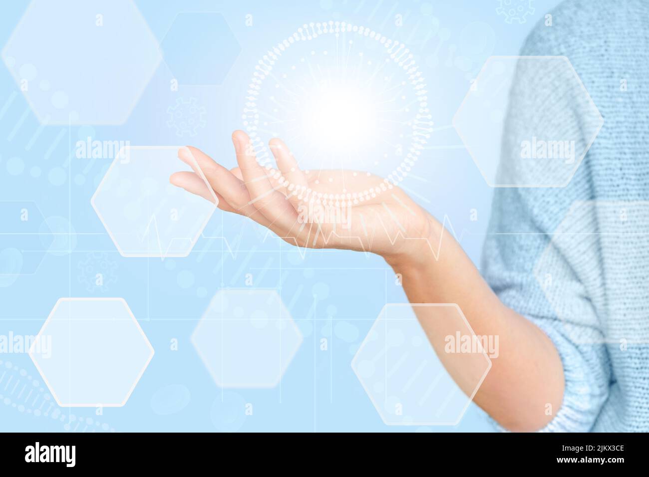 Female hand showing a holographic screen icon. Medical technologies and ...