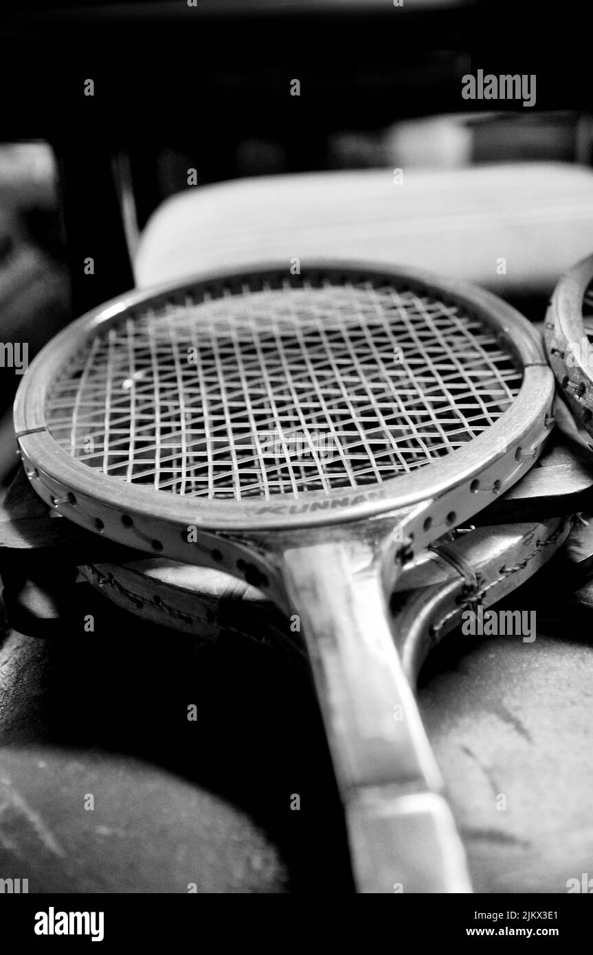 A vertical grayscale closeup shot of a wooden tennis racket Stock Photo ...