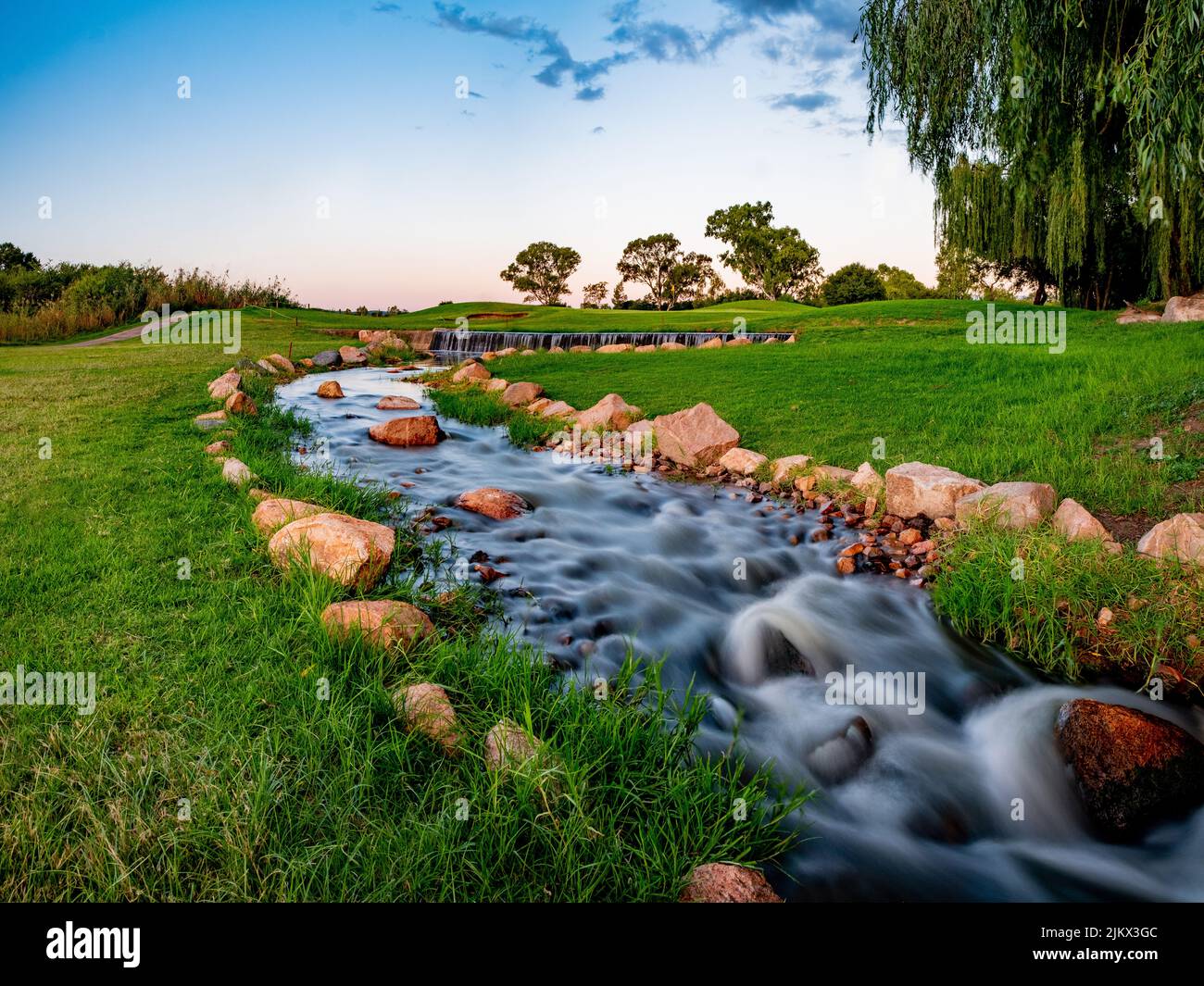 A natural landscape view of a paradise with a river flowing through a ...