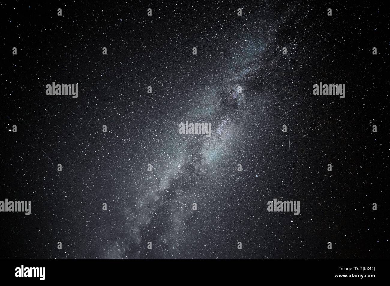 A scenic view of the Milky Way galaxy seen in the night sky Stock Photo ...