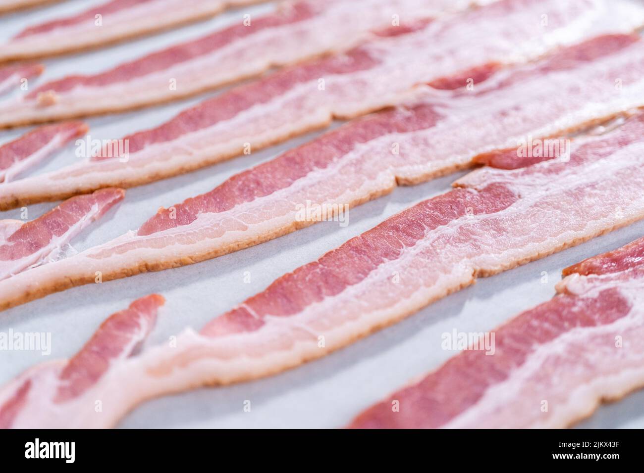 Cooking bacon strips Stock Photo - Alamy