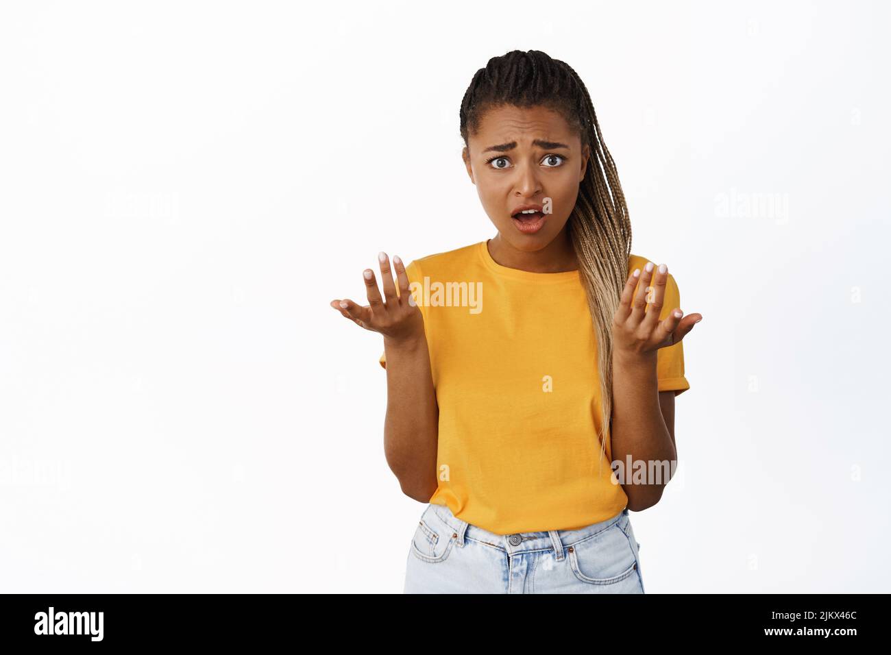 Frustrated Black woman shrugging, shaking hands clueless, cant understand, being confused ...