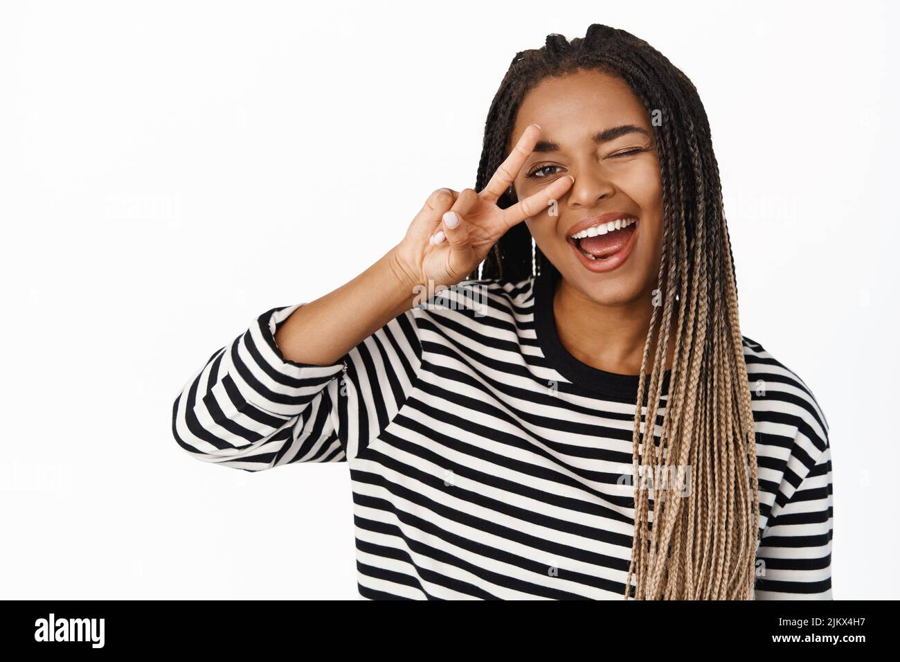 Portrait of positive, healthy black girl smiling and laughing, showing ...