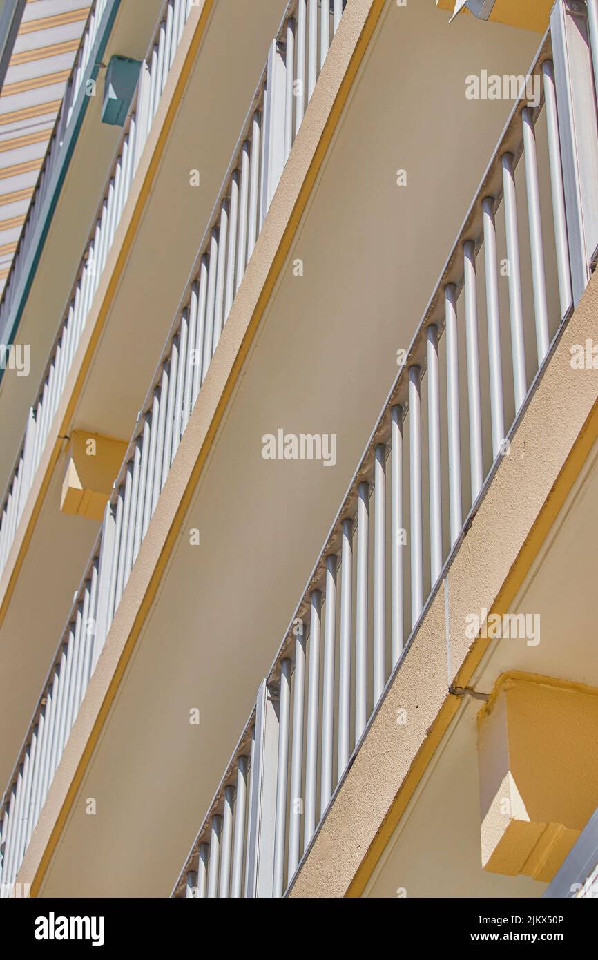 A vertical low angle closeup shot of facade of a building with balconies Stock Photo - Alamy