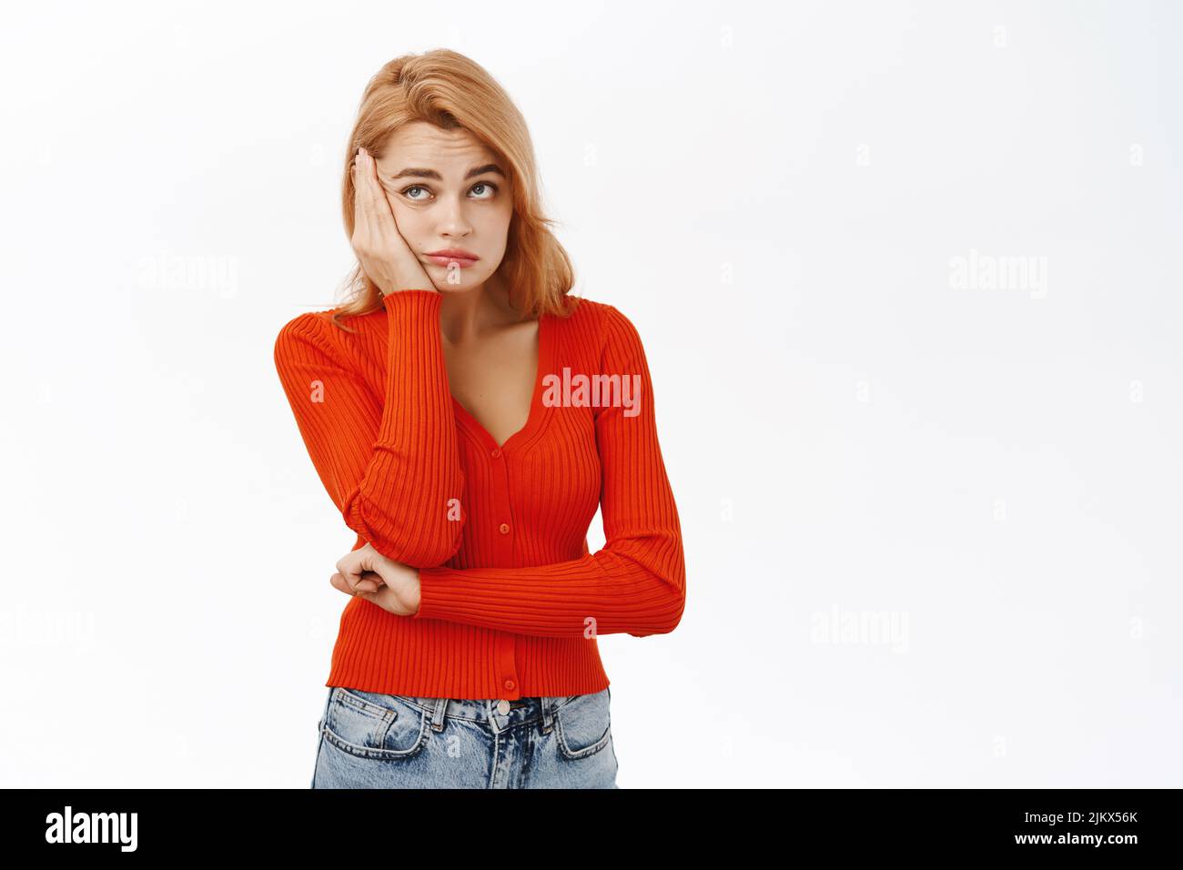Portrait of complicated, sad and tired young redhead woman, lean head ...