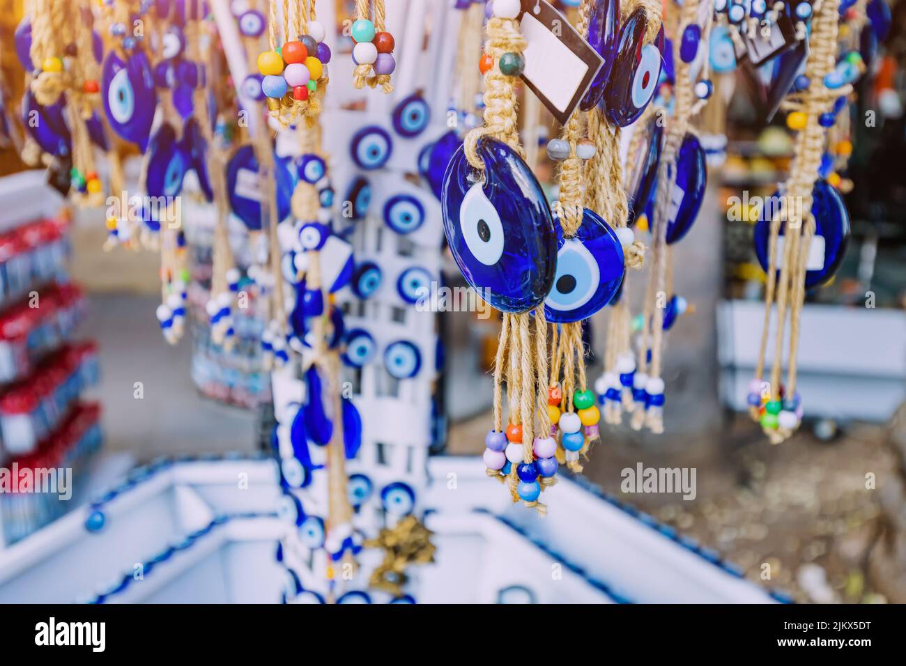Evil eye turkish bead amulets hanging in souvenir store. Gift and ...