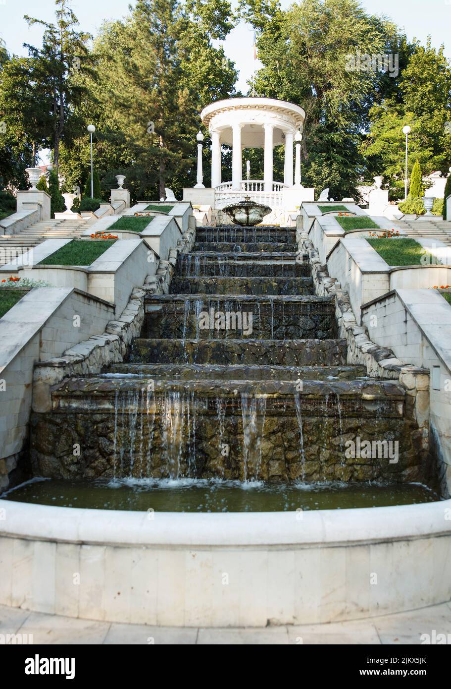 Restored rotunda and cascade ladder filled with water in the park ...