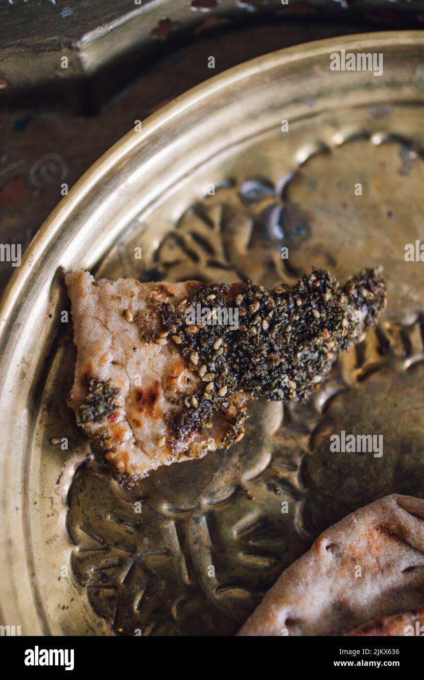middle eastern Za'atar herb, spice blend Bread with olive oil on brass ...